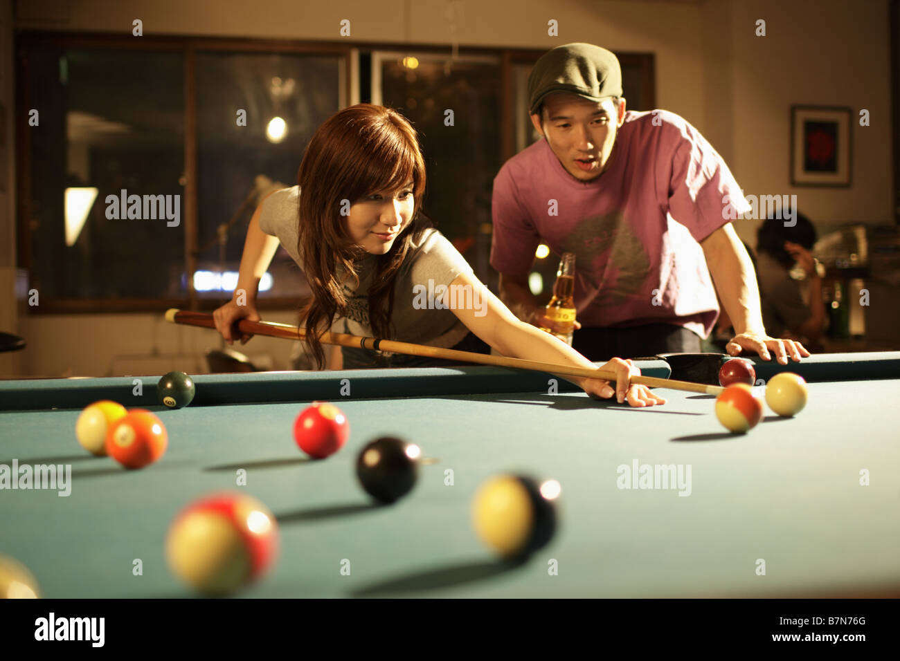 Couple Playing Pool Stock Photo - Alamy