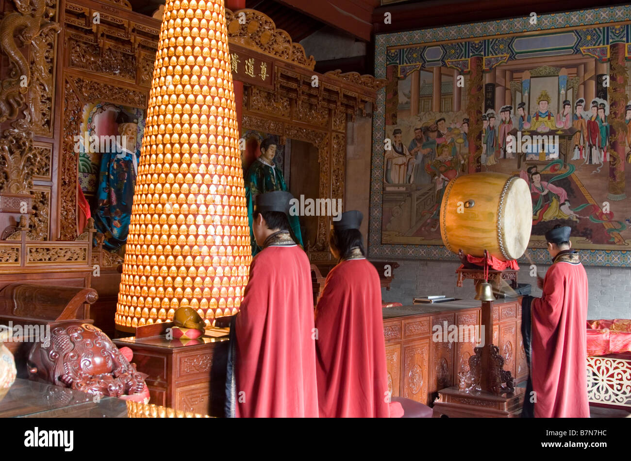 Tao monks performing a religious ceremony with musical instruments at ...