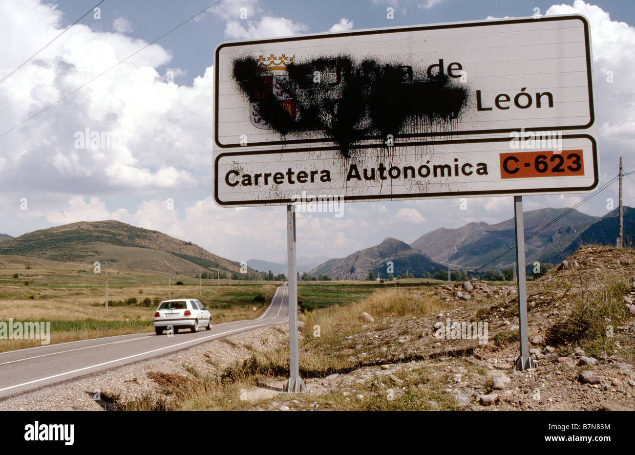Defaced road sign near Sena de Luna on the borders of Leon Province ...
