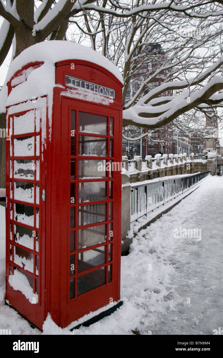 Snow on red telephone box in February, London Stock Photo - Alamy