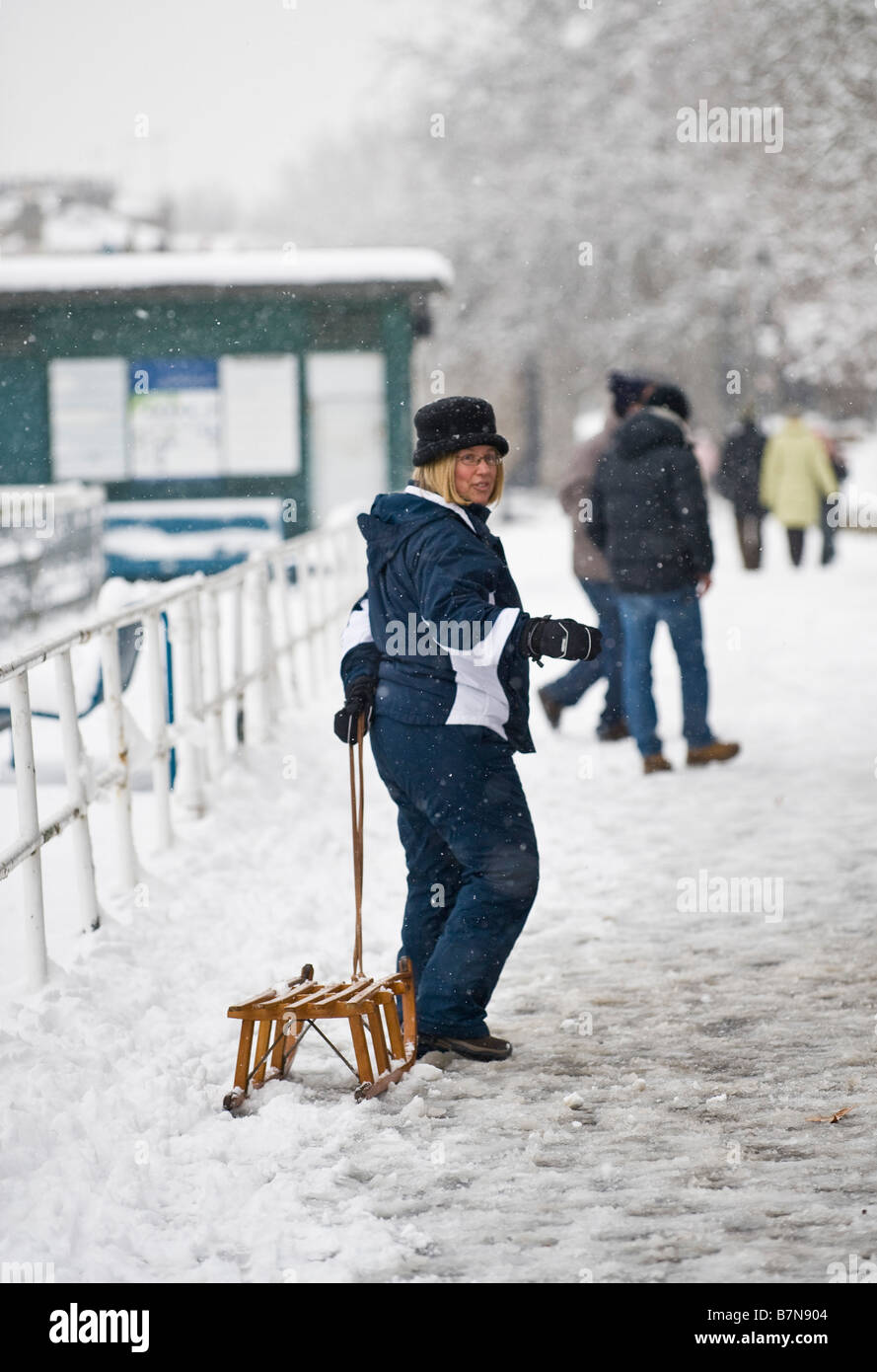 Woman pulling a wooden sledge, Richmond, London, UK Stock Photo - Alamy
