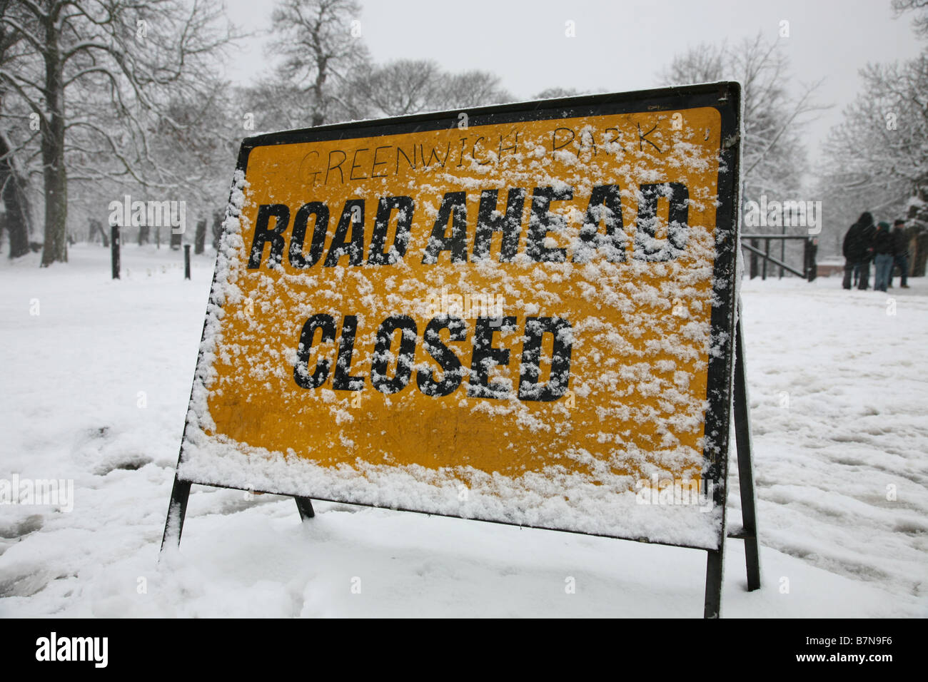 Road ahead closes warning sign due to bad snow and icy conditions in ... Road ahead closes warning sign due to bad snow and icy conditions in ...