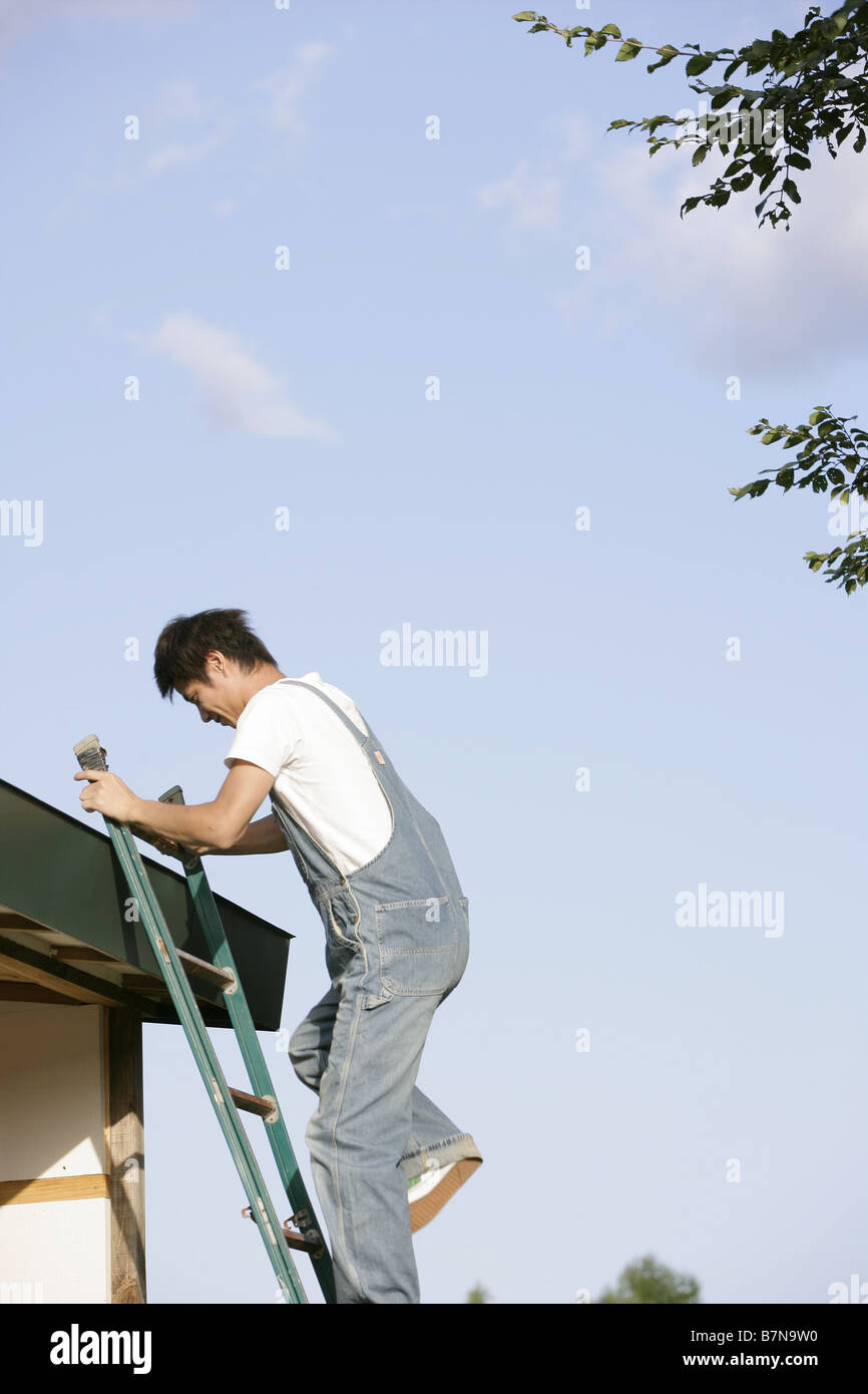 Climbing up a ladder hi-res stock photography and images - Alamy