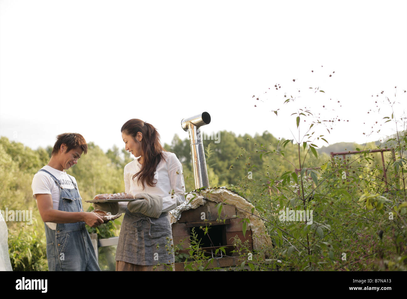 A couple baking home-made bread Stock Photo - Alamy