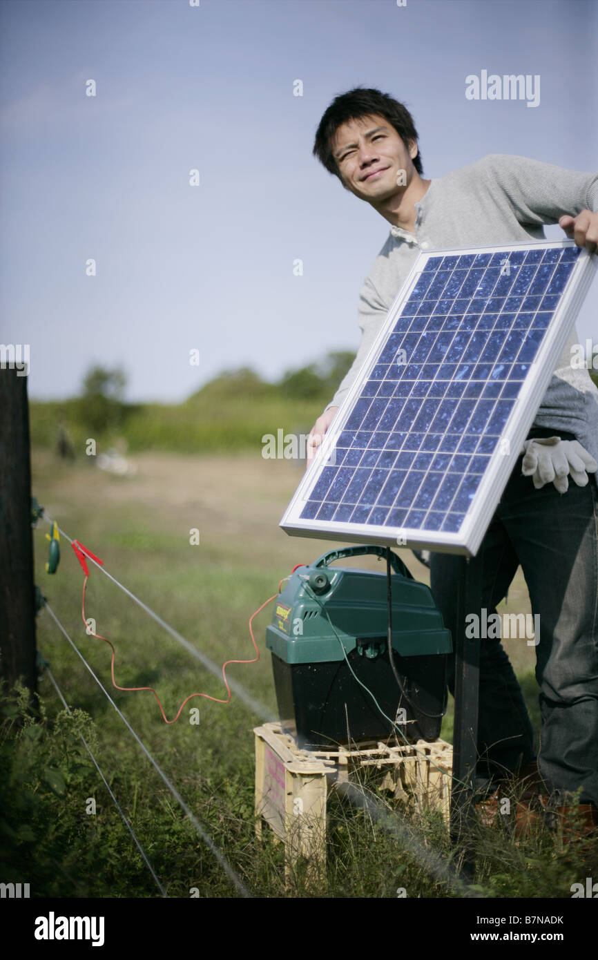 A man and solar panel Stock Photo - Alamy