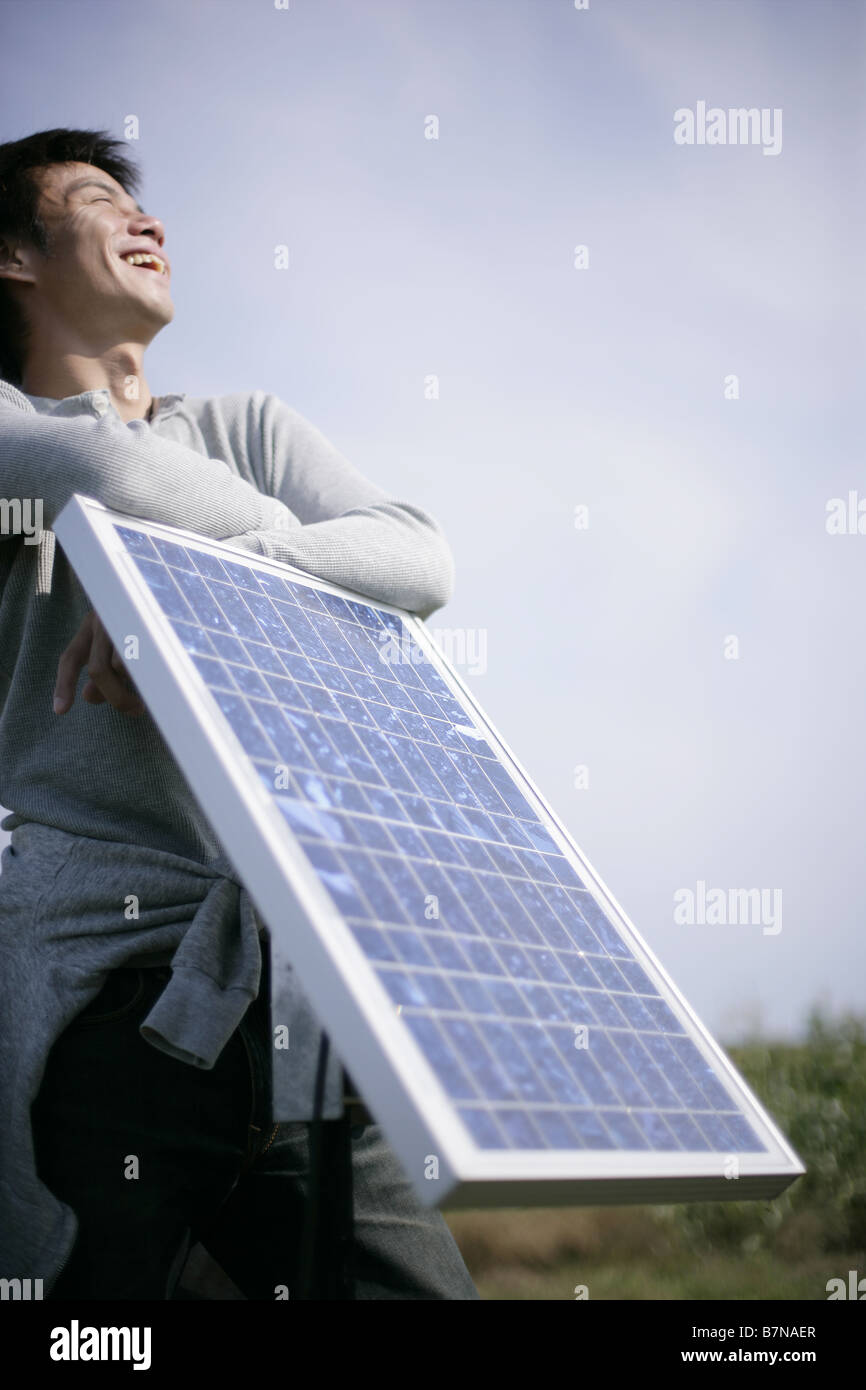 A man and solar panel Stock Photo - Alamy