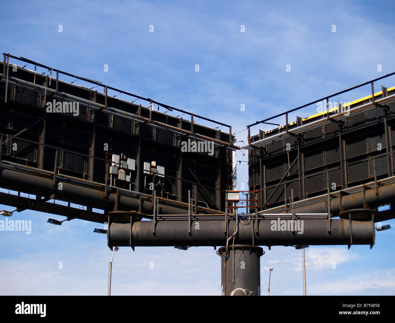The back side of a large two-billboard sign showing metal construction ...