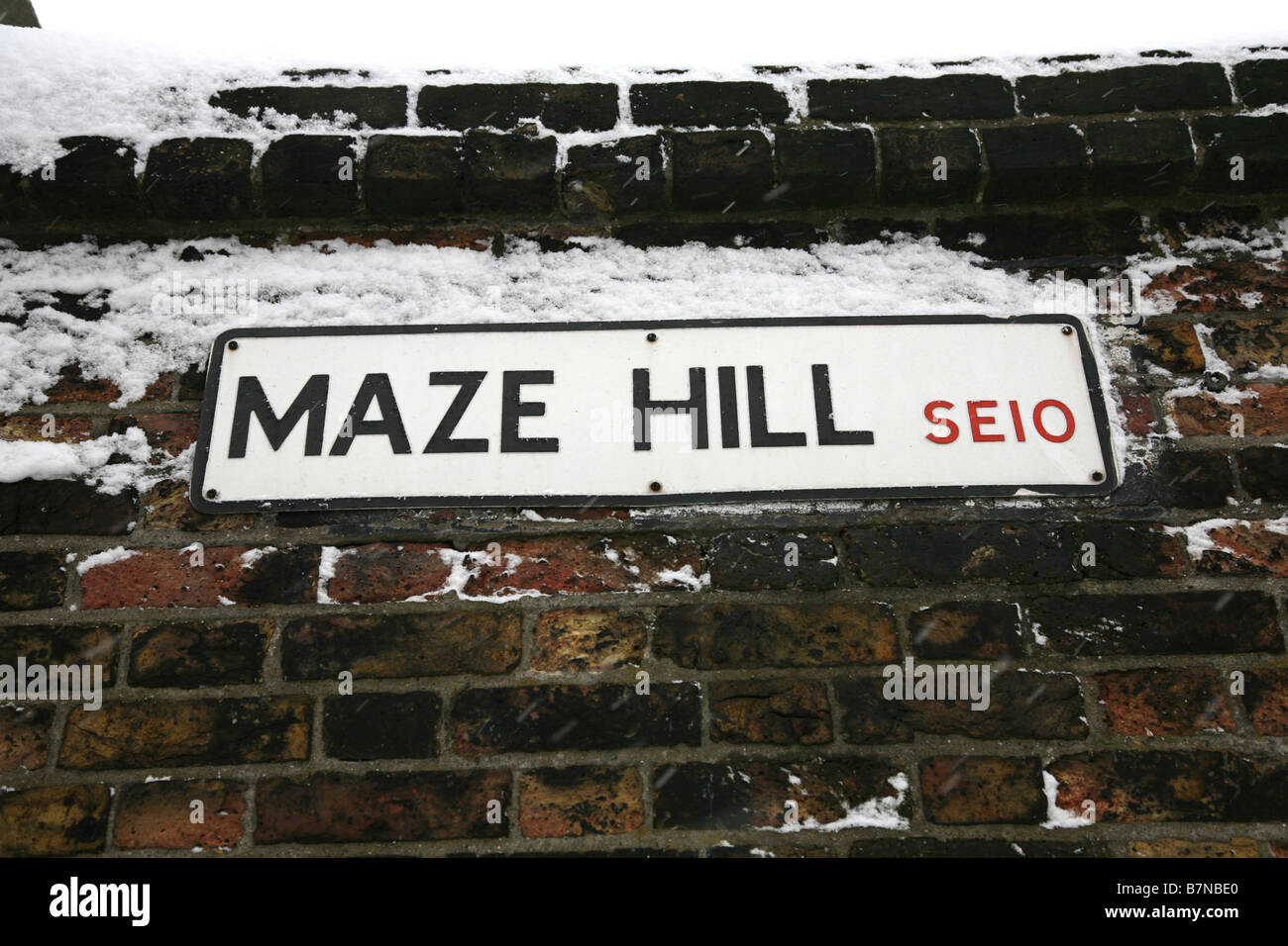 Maze Hill SE10 Greenwich road sign covered in snow Stock Photo - Alamy