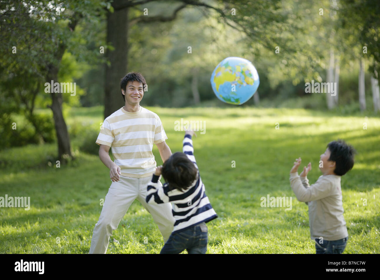 Children playing ball in park hi-res stock photography and images - Alamy