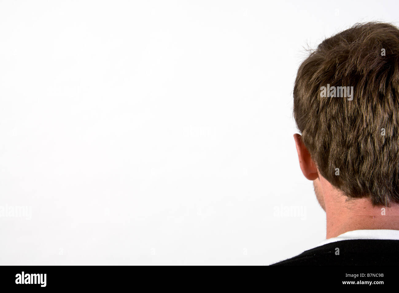 The back of a young man's head off center Stock Photo - Alamy