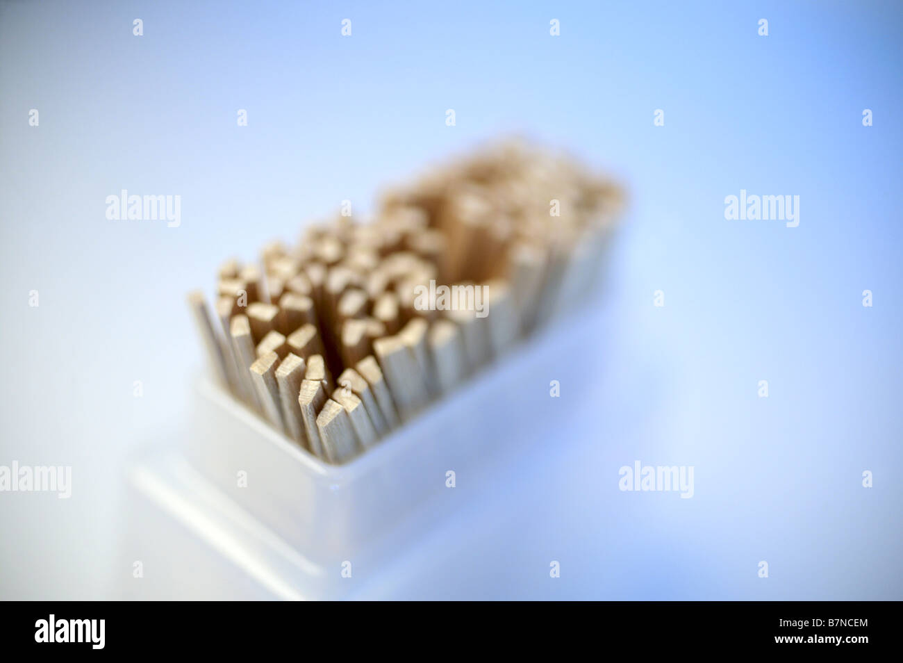 Toothpicks in in a box, blue background unsharped Stock Photo - Alamy