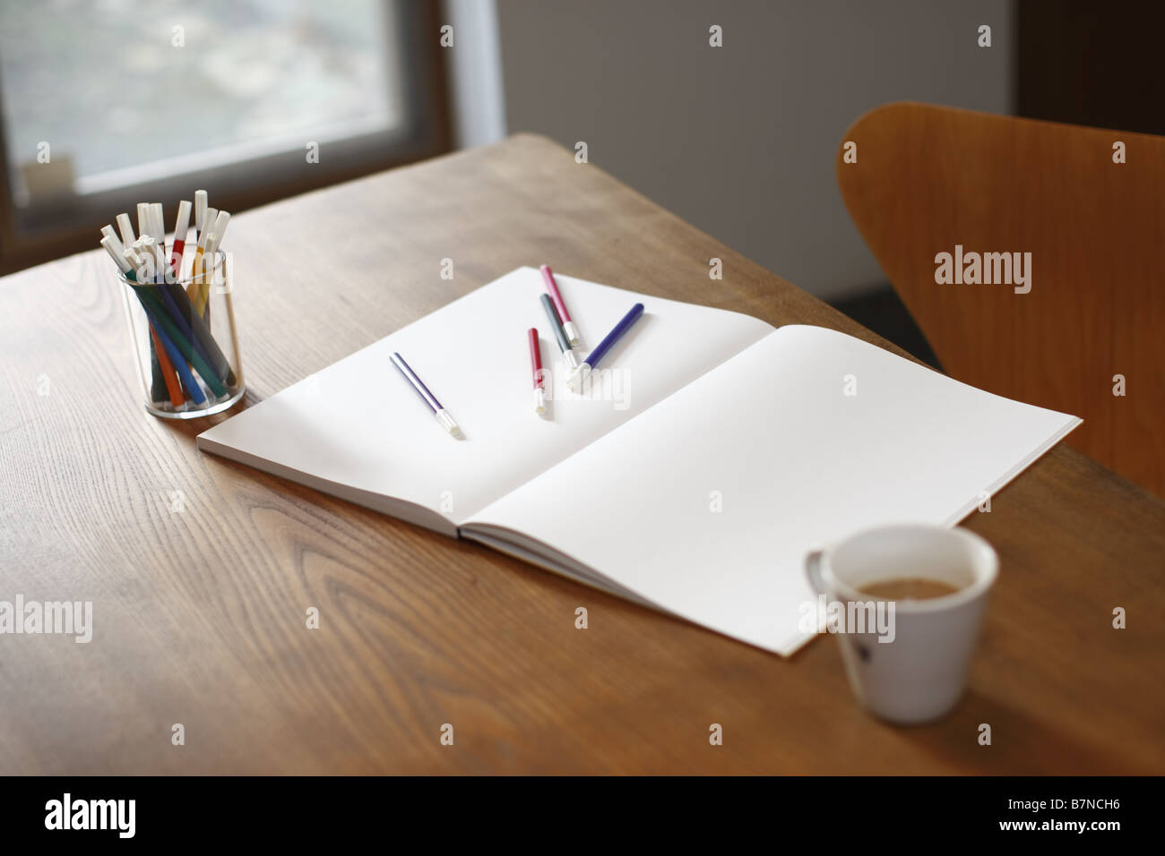A sketchbook and pens Stock Photo - Alamy