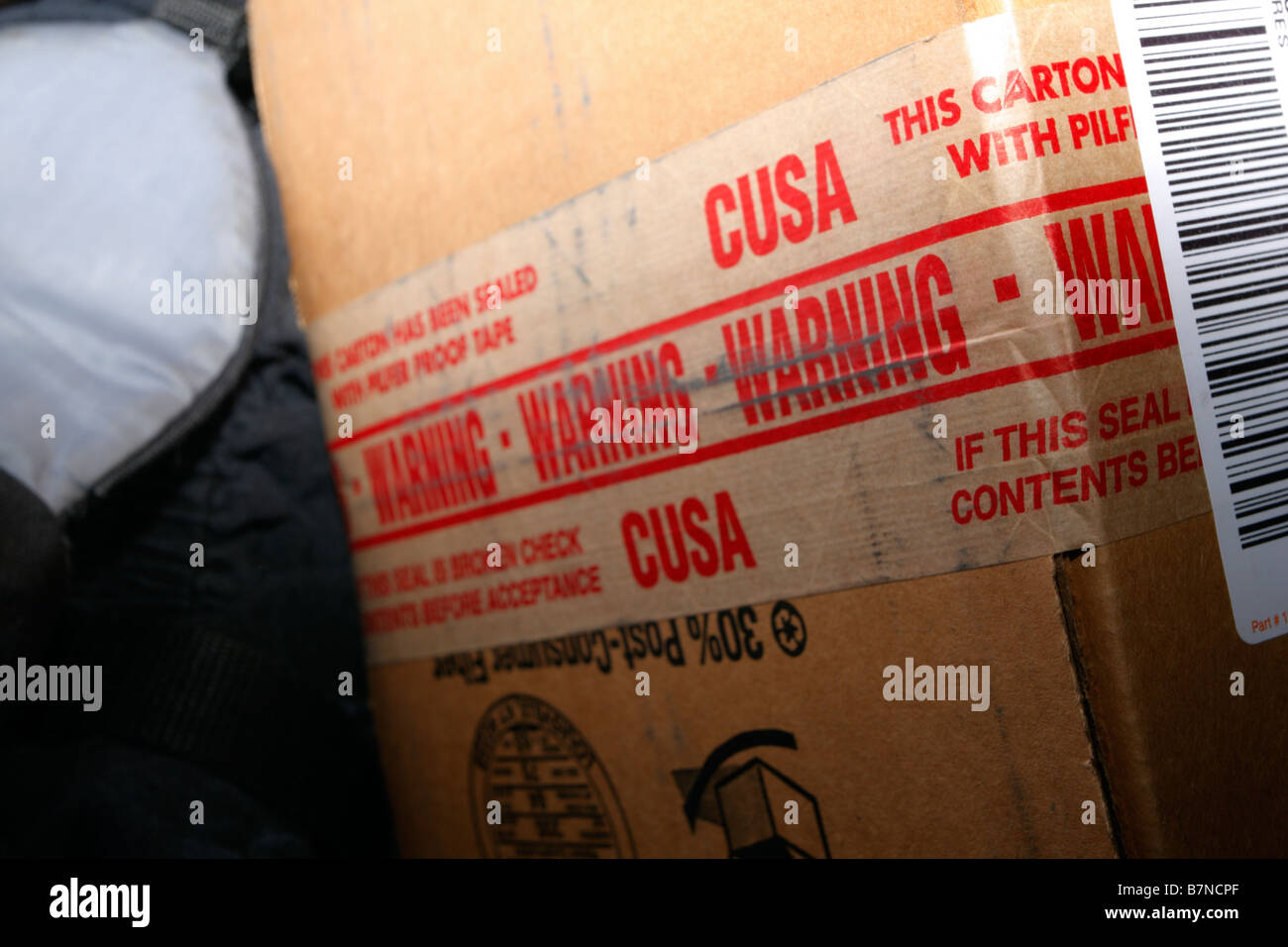 Cardboard box taped seam showing tamper-evident tamper evident tape ...