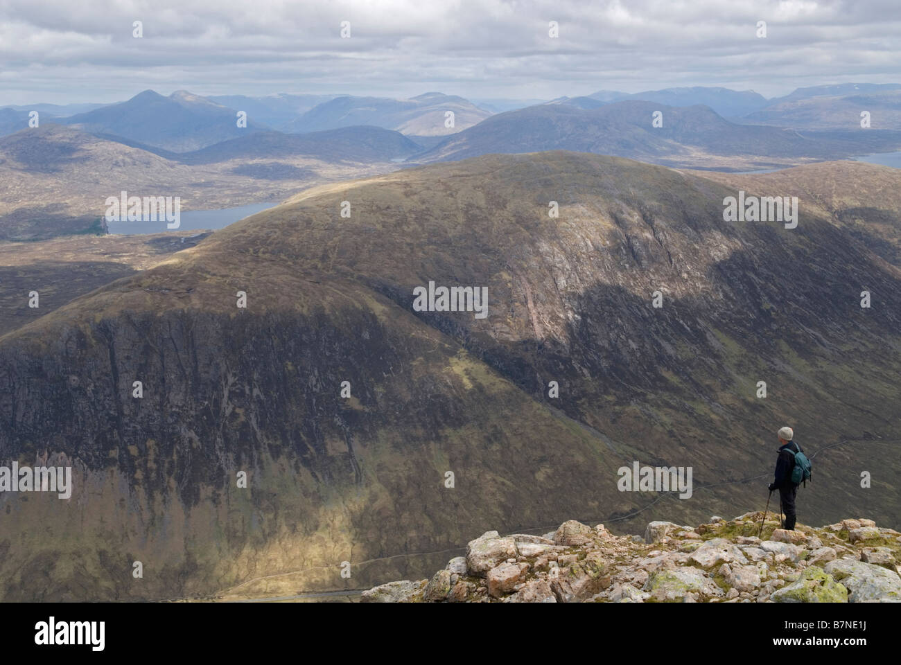Walker on the summit of Stob Dearg Buachaille Etive Mor looking towards ...