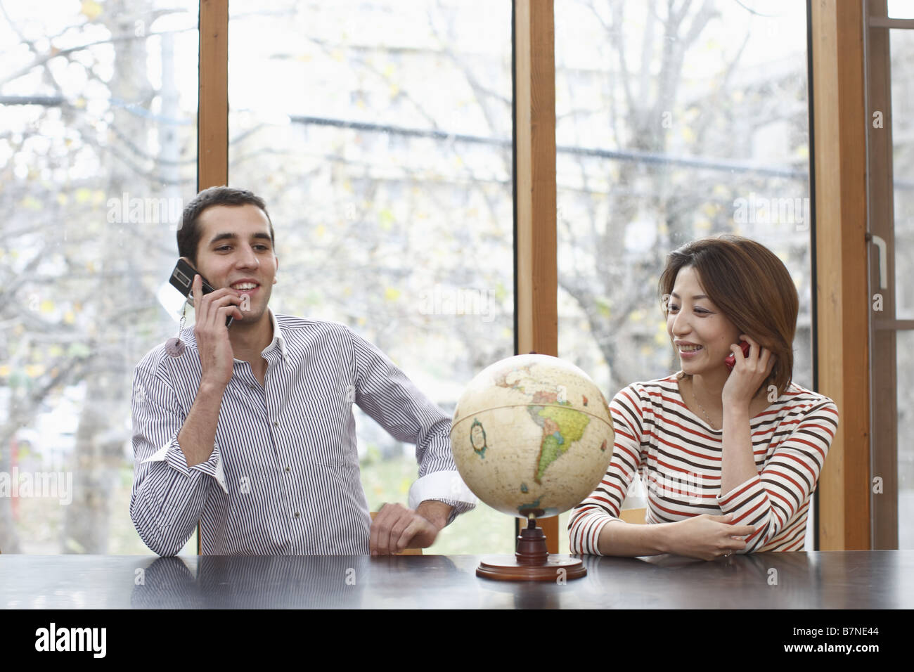 Mobile phone globe in hi-res stock photography and images - Alamy