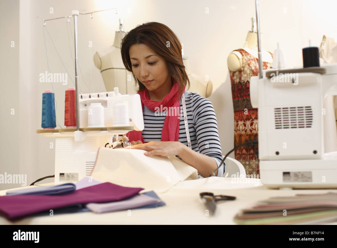 Sewer working using a sewing machine Stock Photo - Alamy
