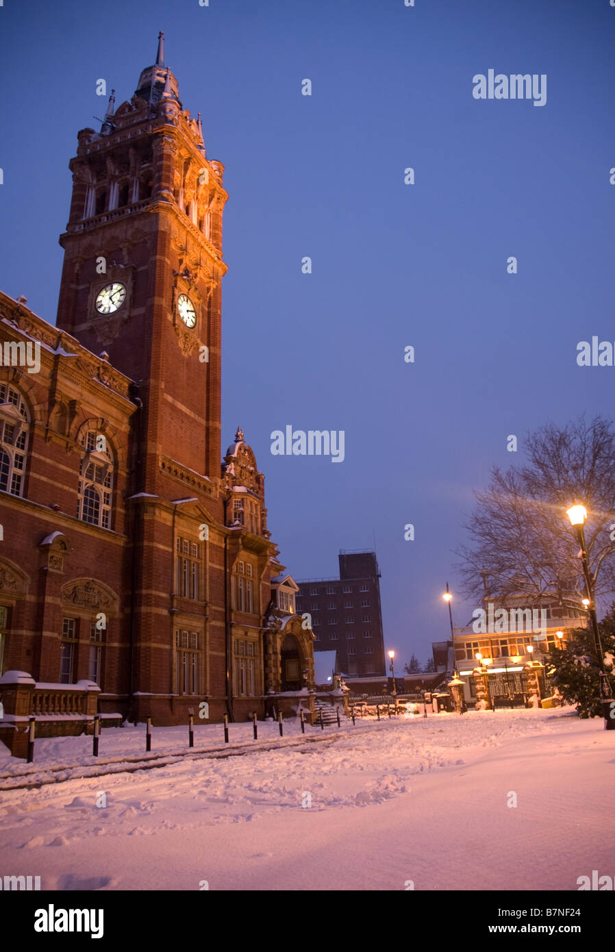 snow falls in the early evening , outside east ham town hall london ...