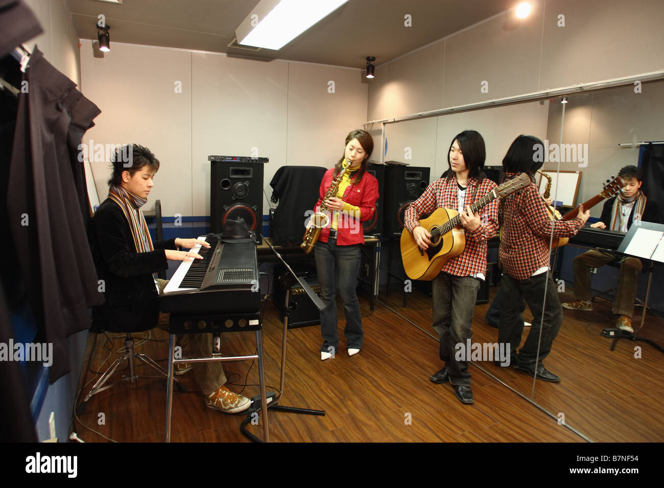 Young people playing instruments Stock Photo - Alamy
