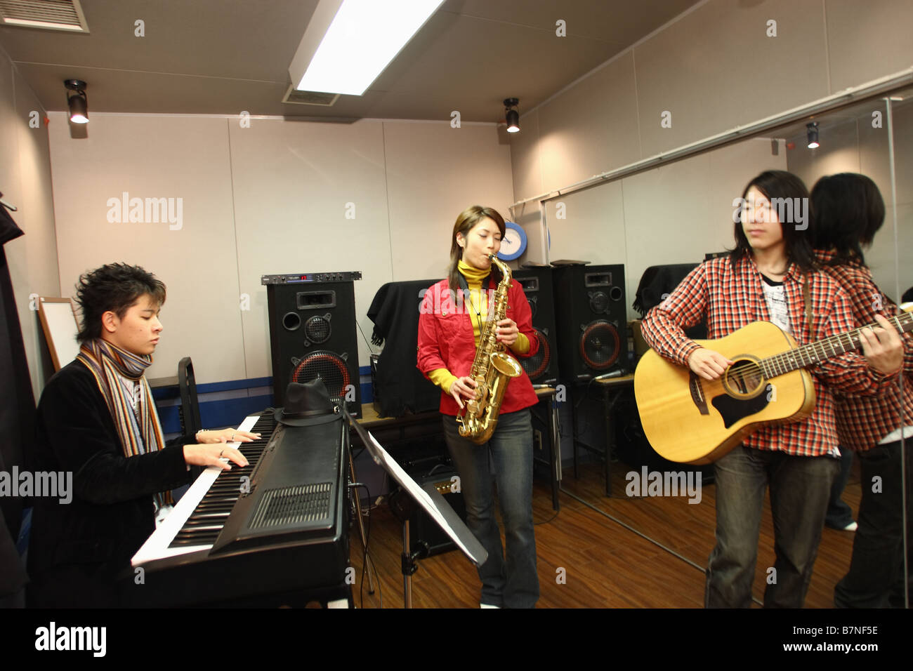 Young people playing instruments Stock Photo - Alamy