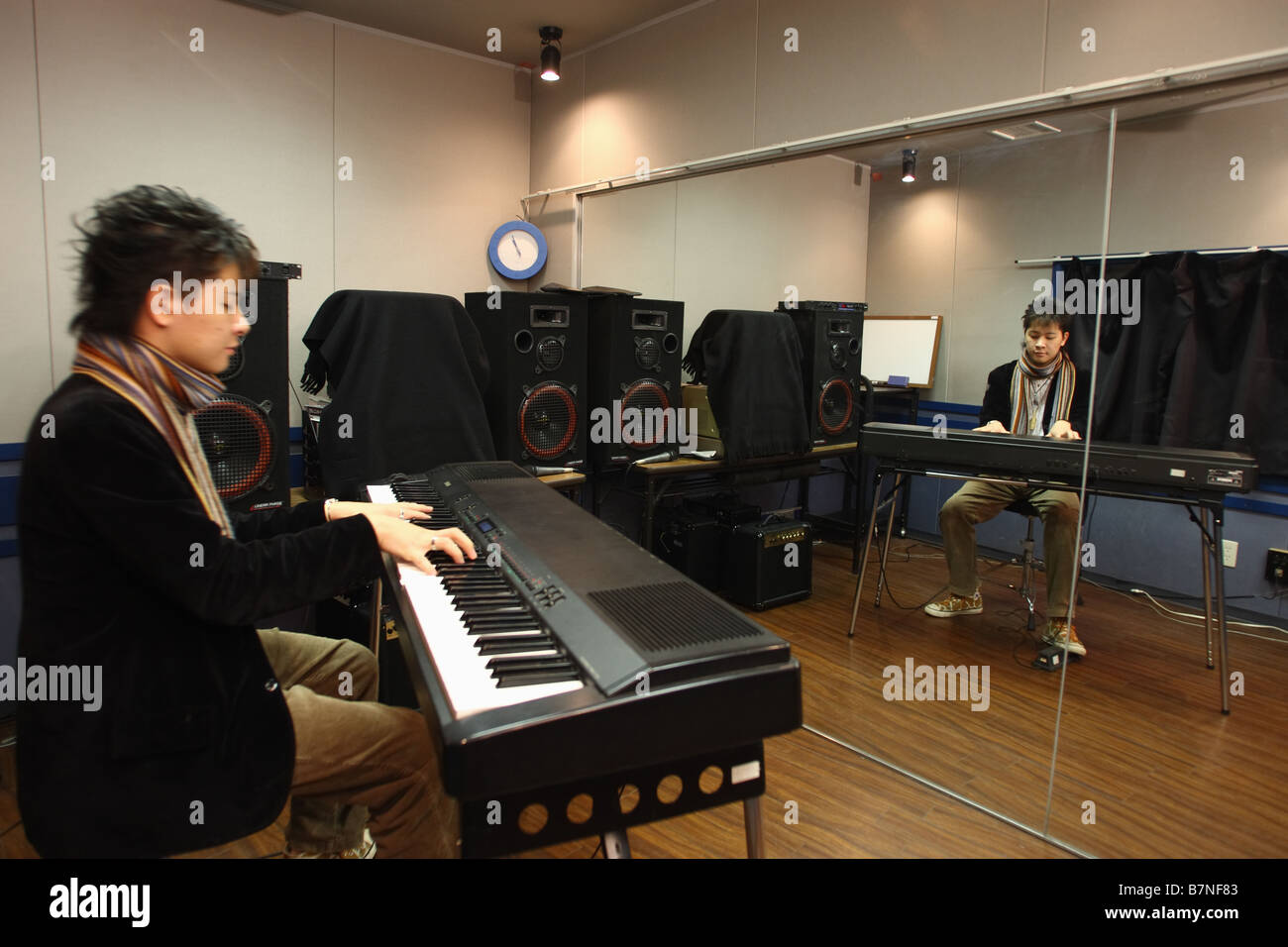 Man playing the electronic piano Stock Photo - Alamy