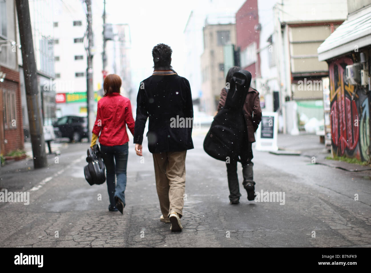 Young people walking a street Stock Photo - Alamy