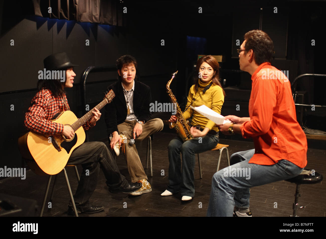 Young people discussing in the recording studio Stock Photo - Alamy