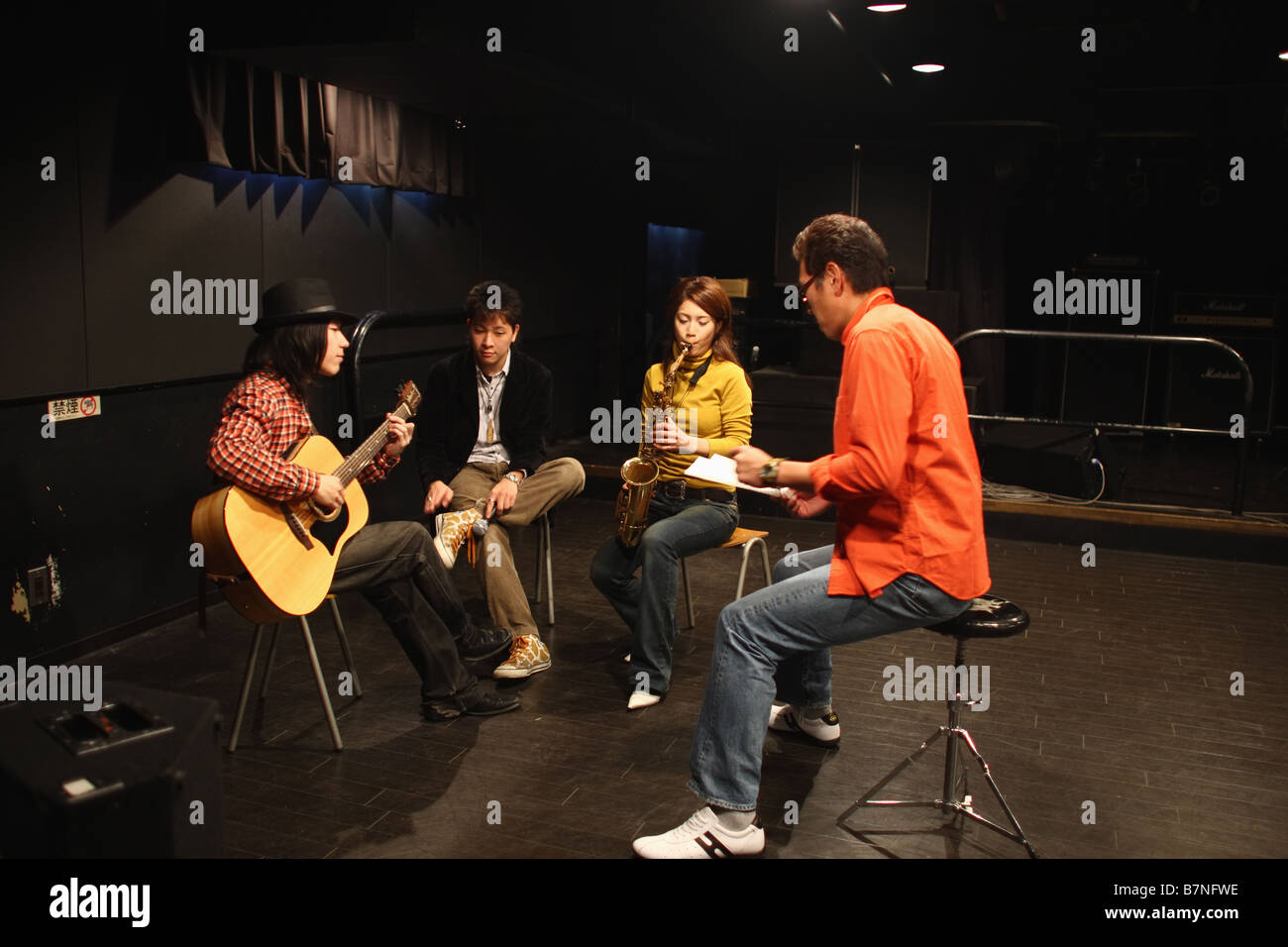 Young people discussing in the recording studio Stock Photo - Alamy