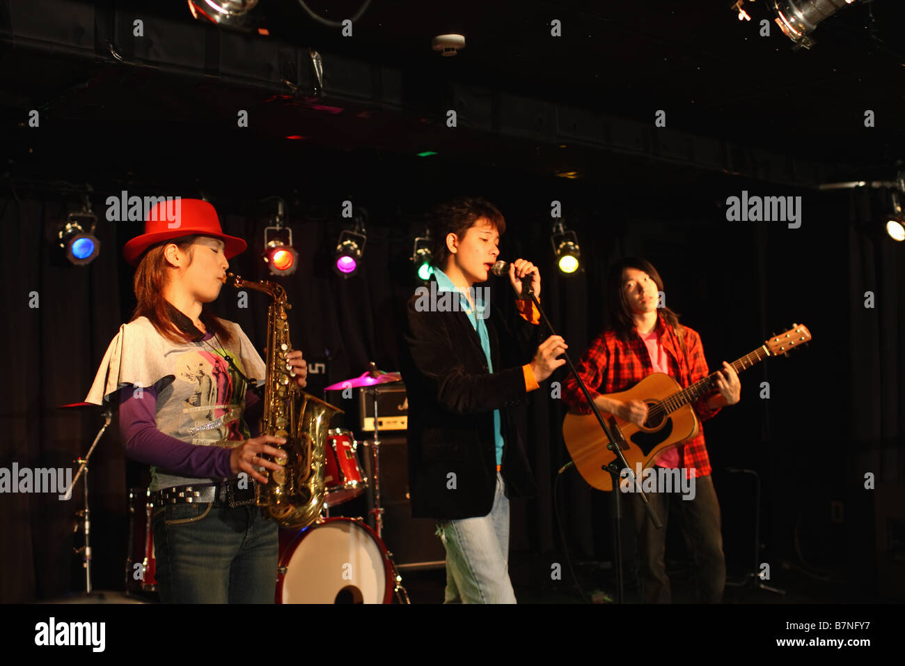 Young people playing instruments on the stage Stock Photo - Alamy