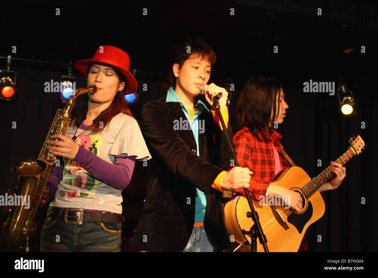 Young people playing instruments on the stage Stock Photo - Alamy