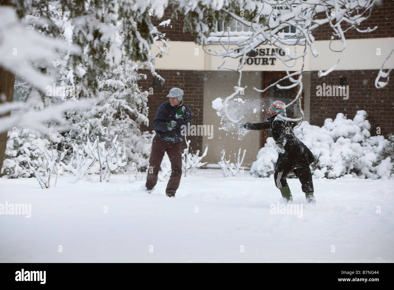 A couple have a snowball fight hi-res stock photography and images - Alamy