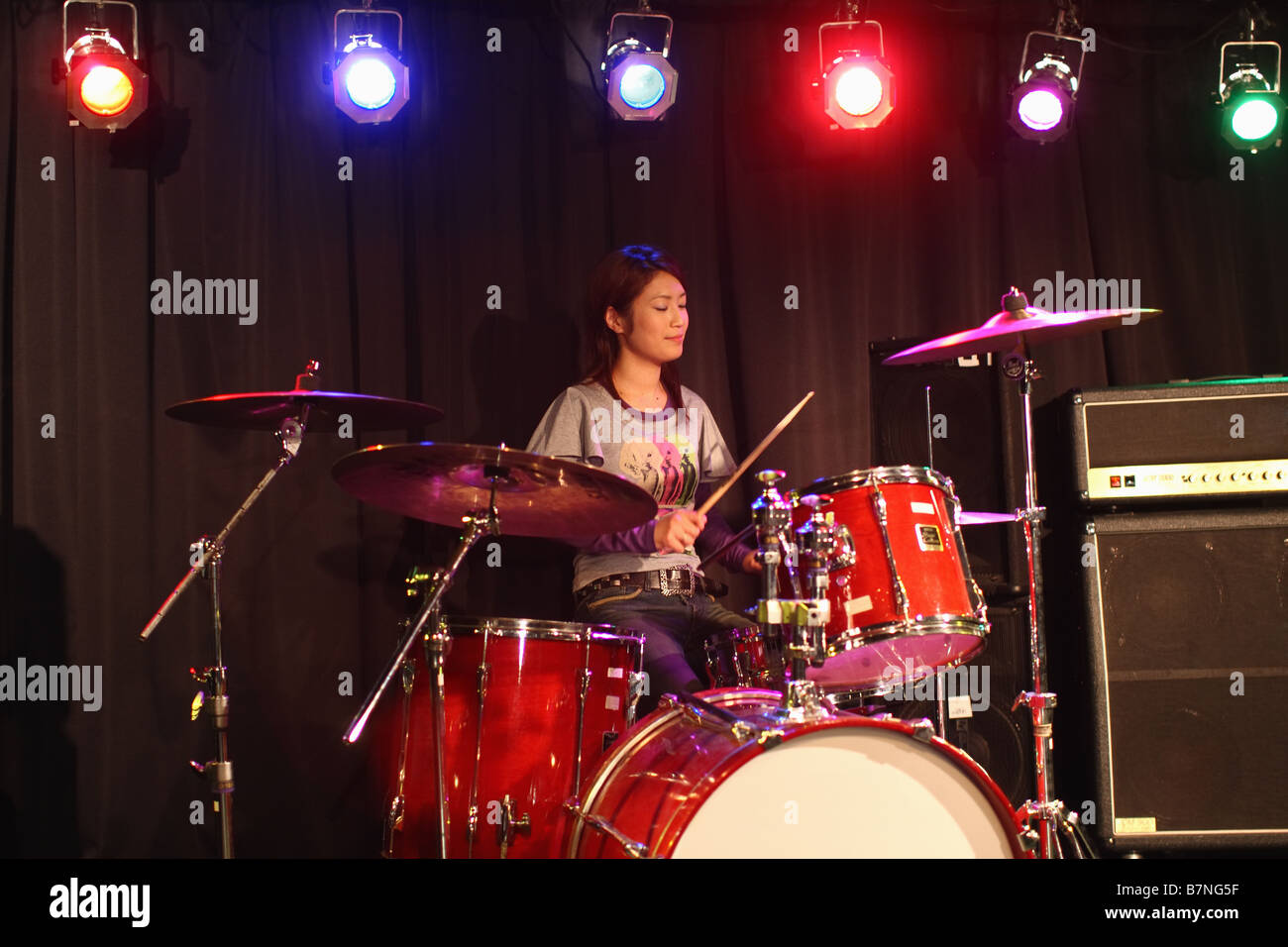 Young people playing instruments on the stage Stock Photo - Alamy