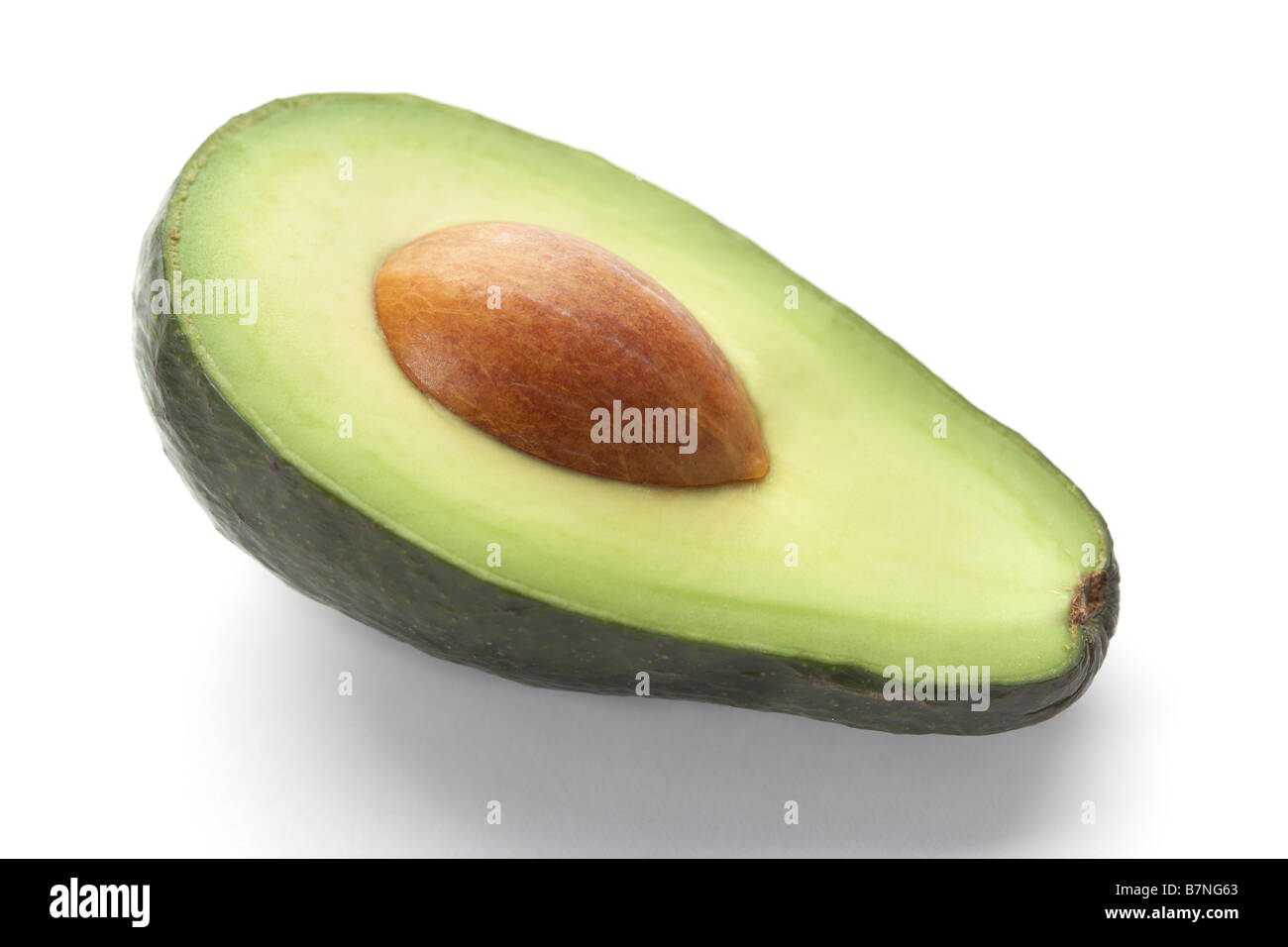 Avocado cut in half Stock Photo - Alamy