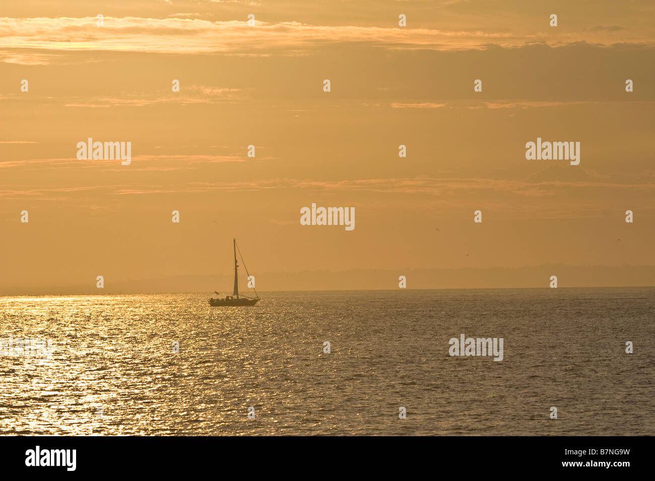 Yacht at Sunset on the Solent Stock Photo - Alamy