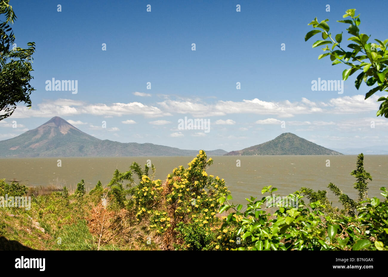 Momotombo, active volcano with its smaller neighbor, Momotombito, on ...