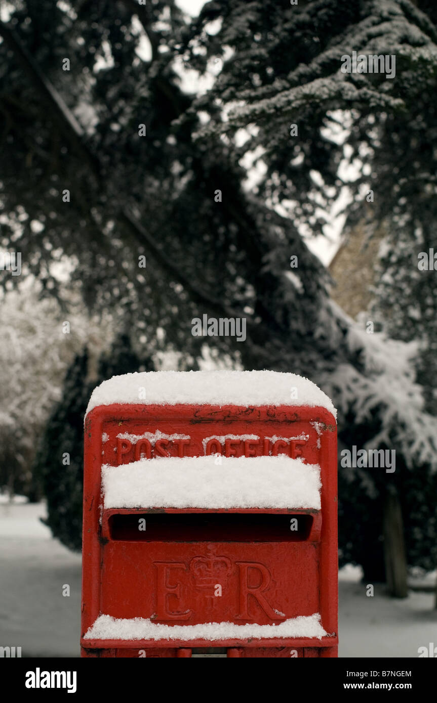 Snow village uk post box hi-res stock photography and images - Alamy