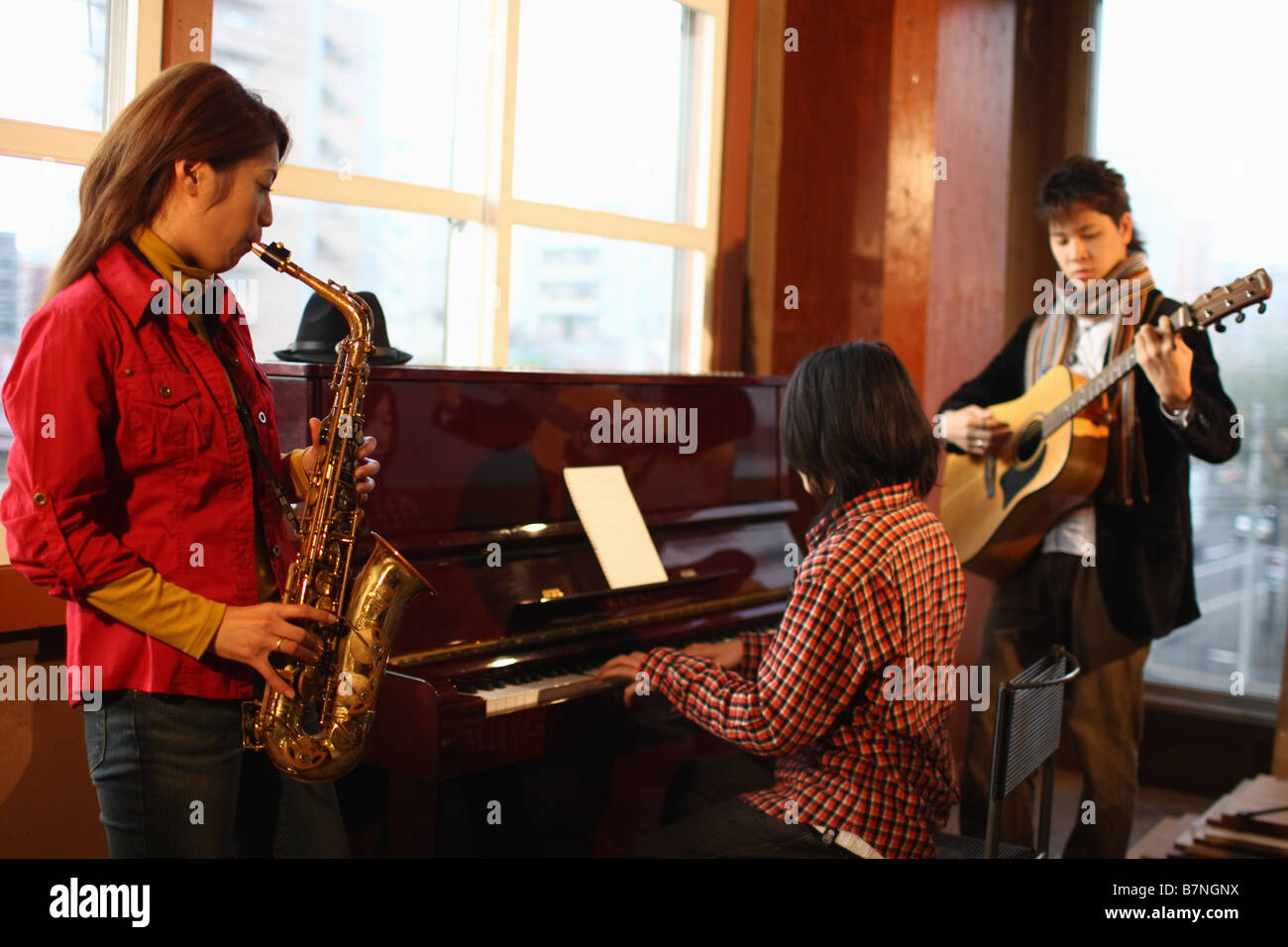 Young people playing instruments Stock Photo - Alamy
