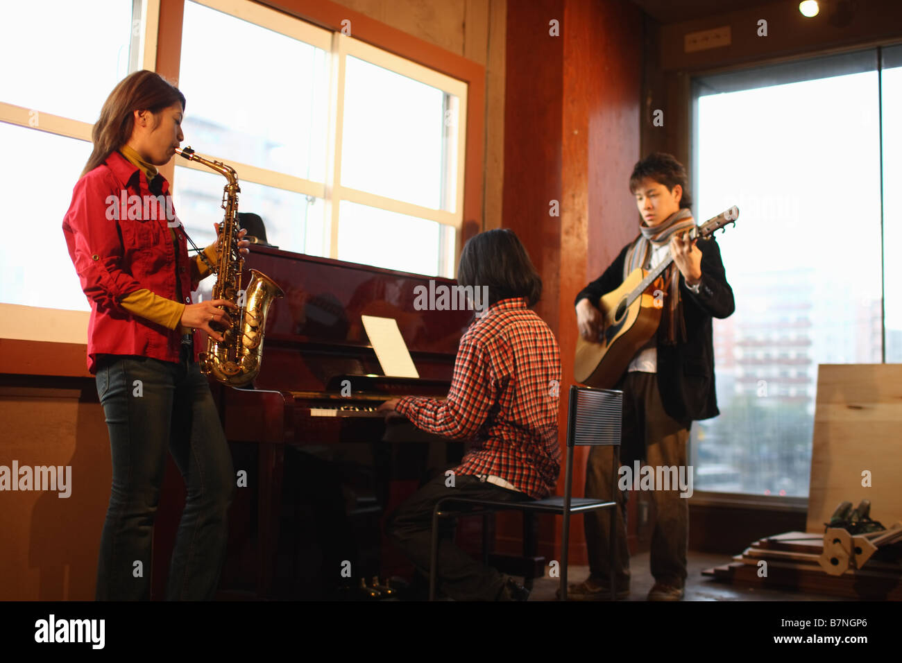 Young people playing instruments Stock Photo - Alamy