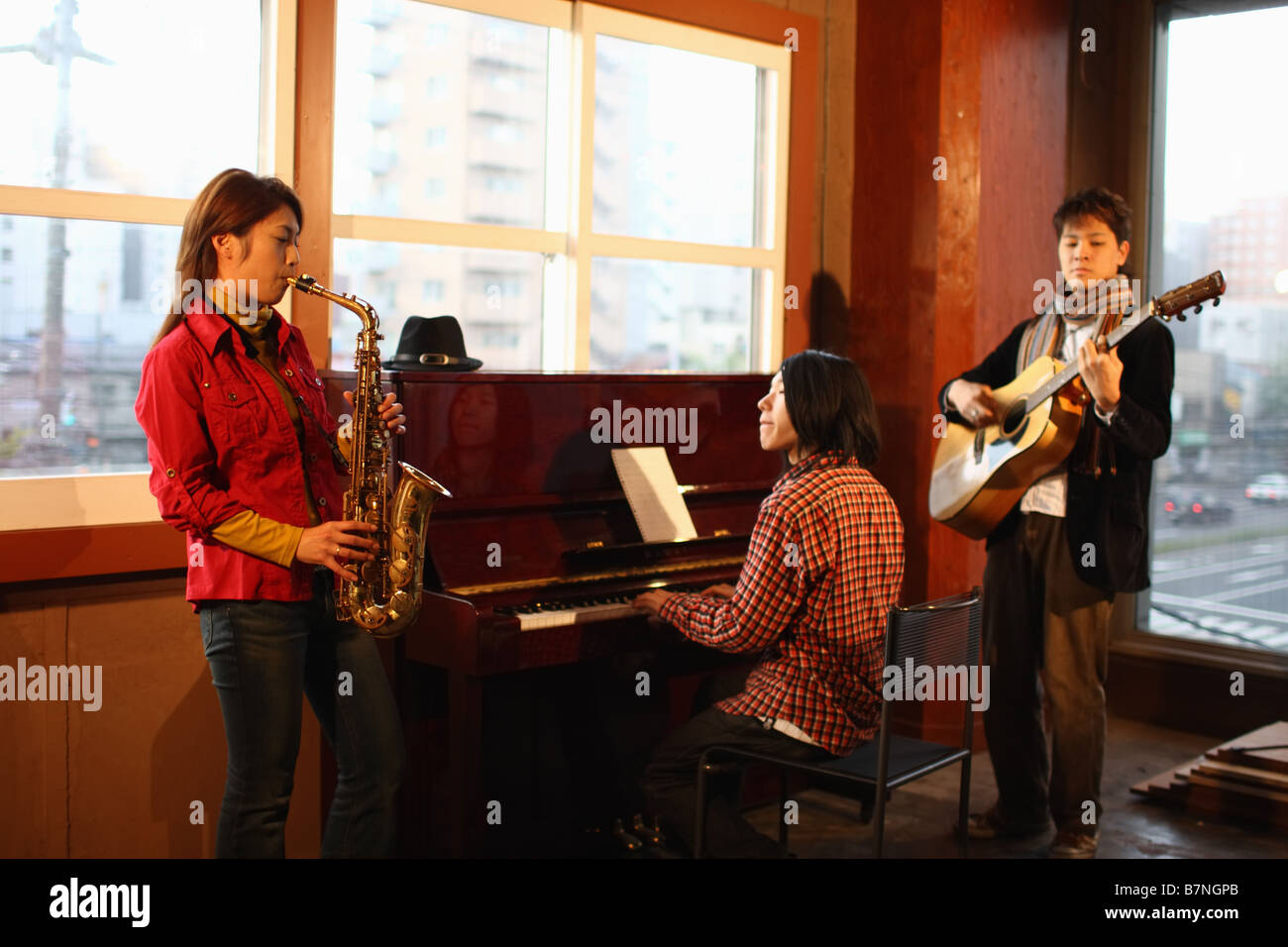 Young people playing instruments Stock Photo - Alamy