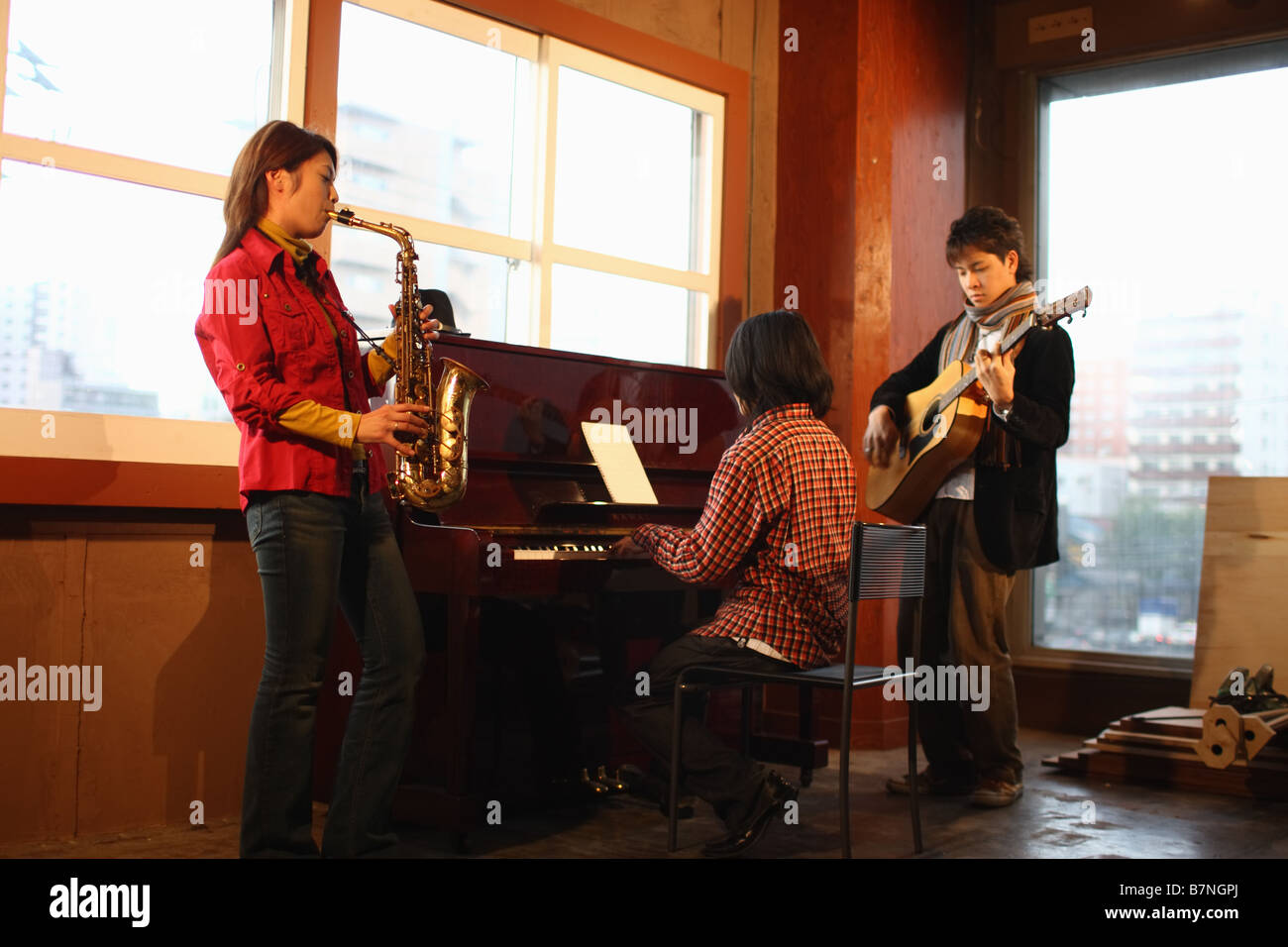 Young people playing instruments Stock Photo - Alamy