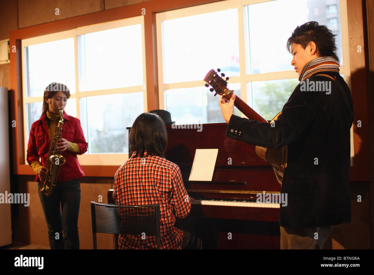 Young people playing instruments Stock Photo - Alamy
