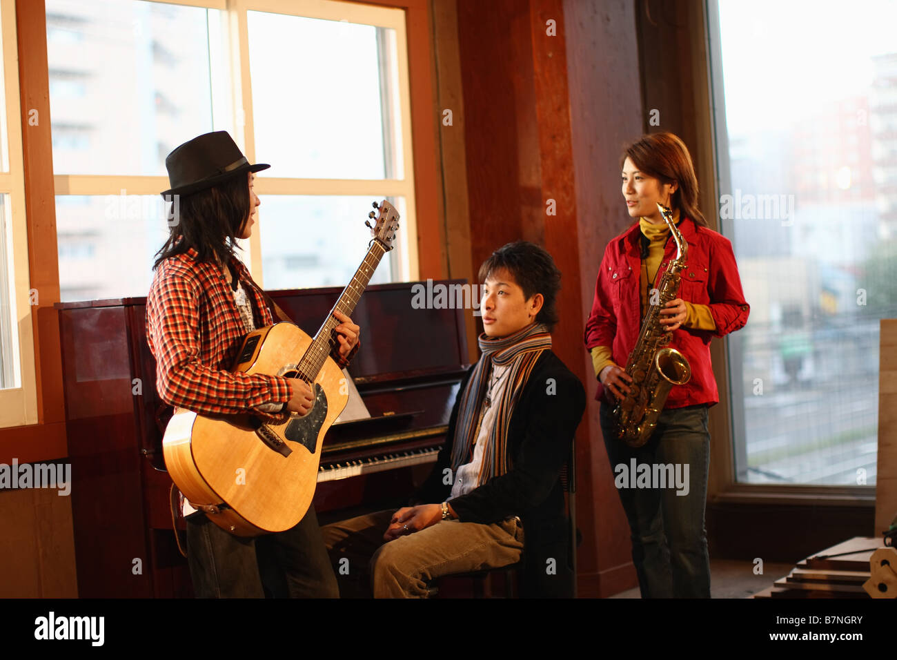 Young people playing instruments Stock Photo - Alamy