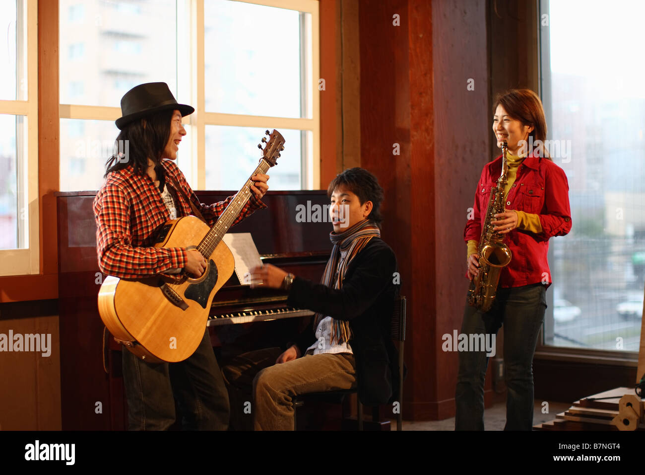 Young people playing instruments Stock Photo - Alamy