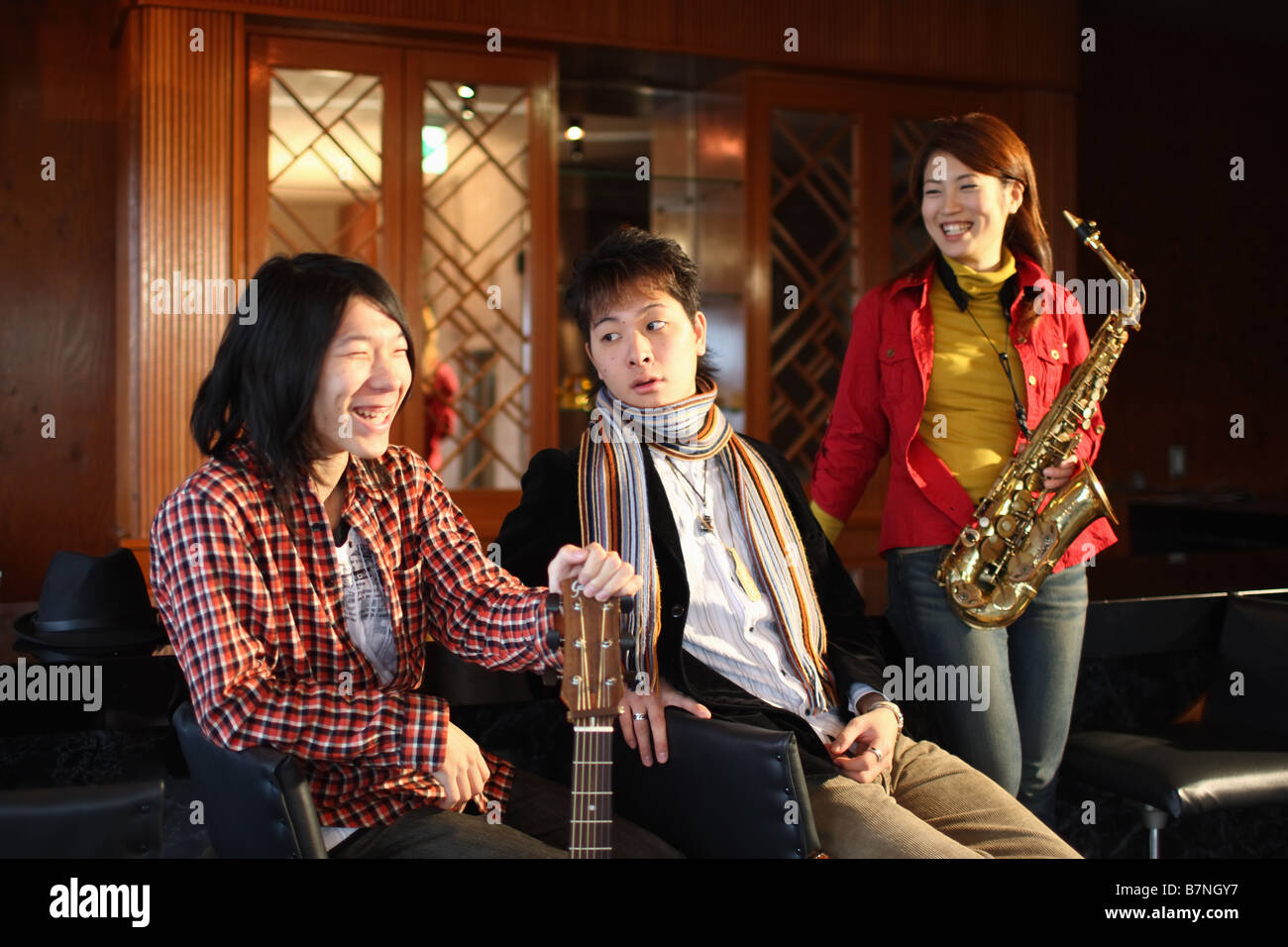 Young people playing instruments in a bar Stock Photo - Alamy