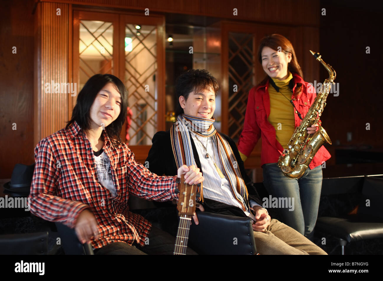 Young people playing instruments in a bar Stock Photo - Alamy