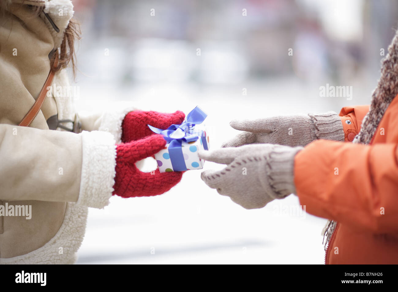 Giving a present Stock Photo - Alamy