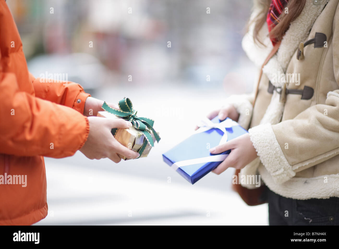 Couple giving presents each other Stock Photo - Alamy