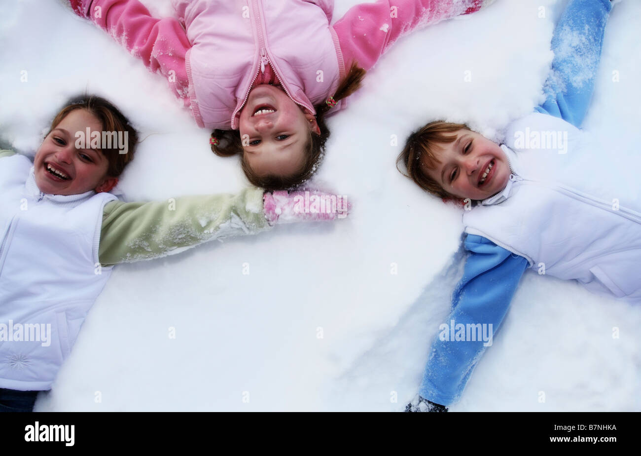 Children making snow angels hi-res stock photography and images - Alamy