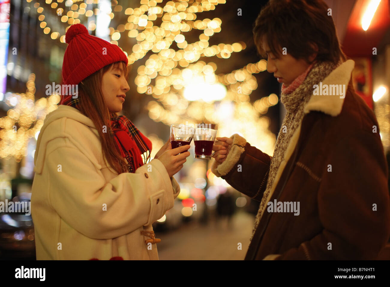 Couple drinking hot wine Stock Photo - Alamy