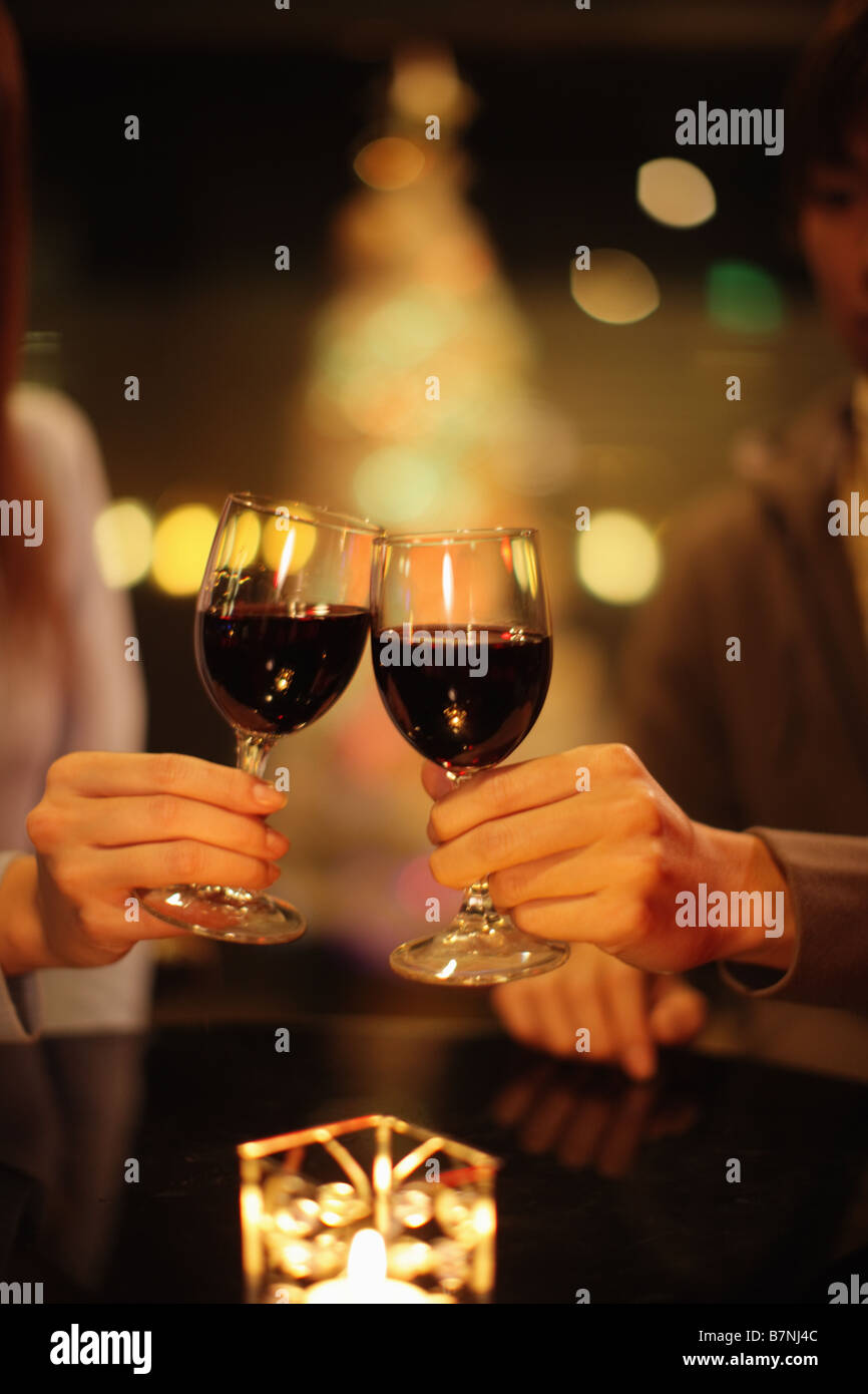 Toasting with red wine Stock Photo - Alamy