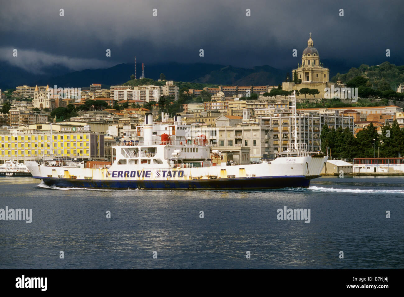 Car ferry Pace approaching Messina waterfront and dome of Cristo Re ...